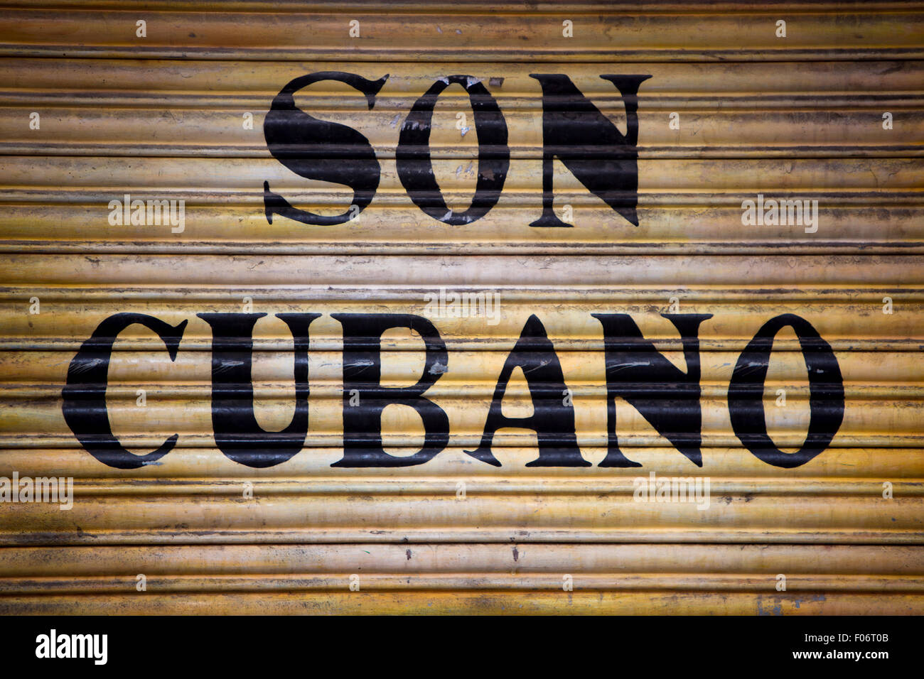 Graffiti on a door representing the flag of cuba and the words cuban ...