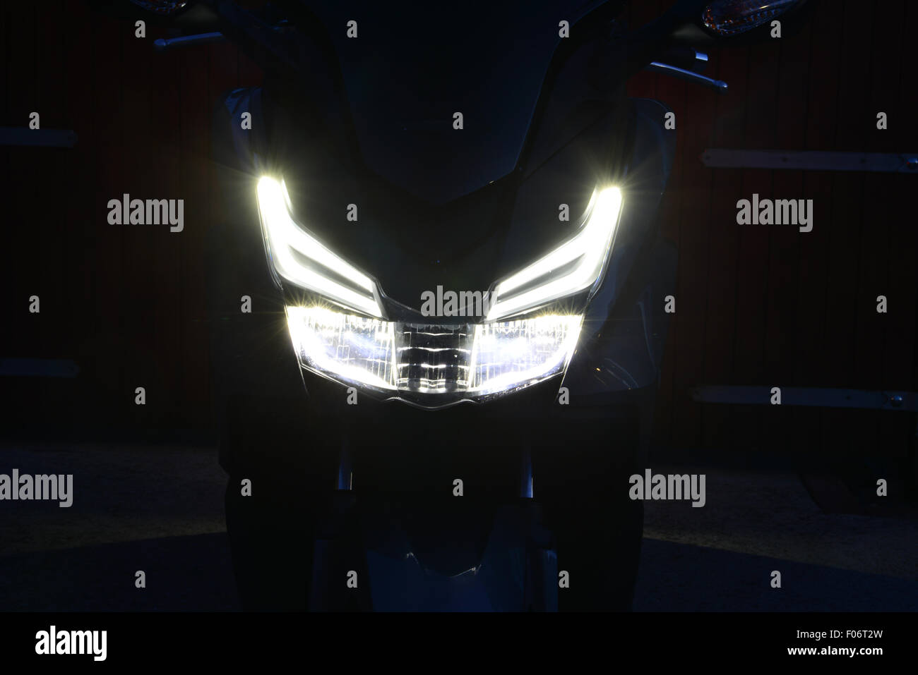 LED headlights on a scooter Stock Photo - Alamy