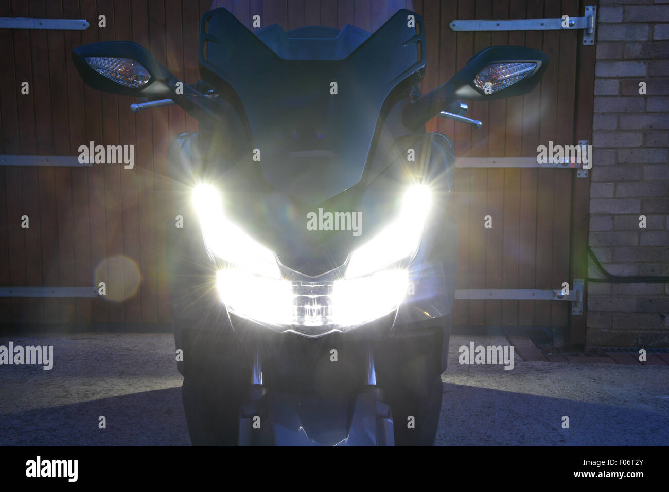 LED headlights on a scooter Stock Photo - Alamy