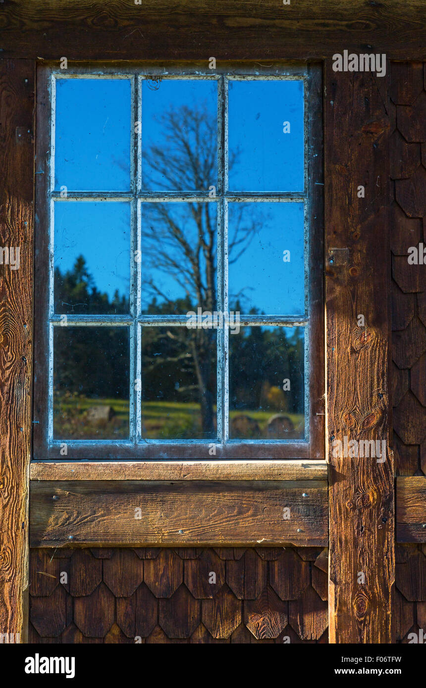 Old window with reflection of the landscape Stock Photo - Alamy