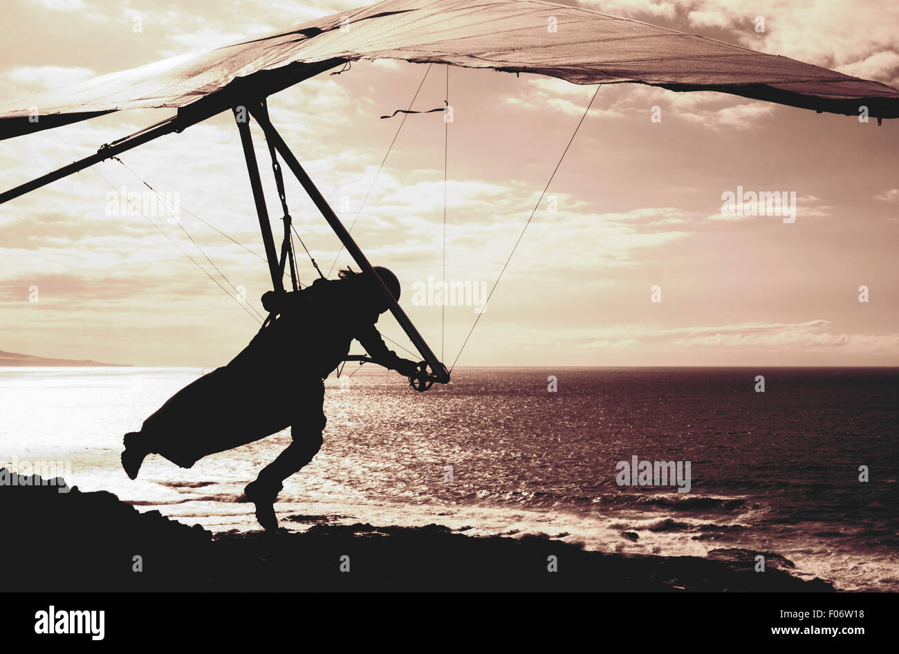 Hang Glider taking off from coastal mountain Stock Photo - Alamy