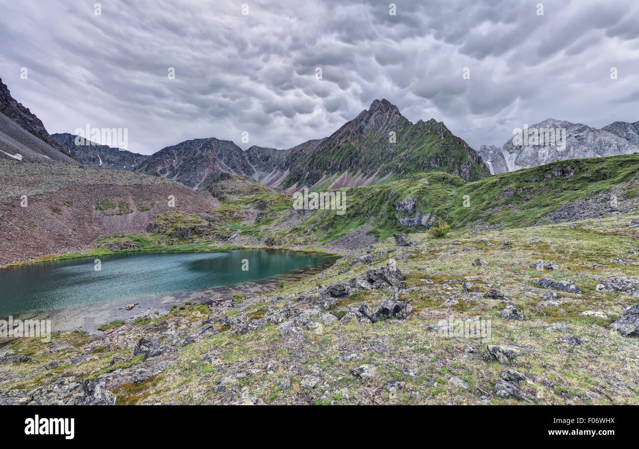 Mammatus cloud over the mountain tundra in Eastern Siberia. Tunka Alps ...
