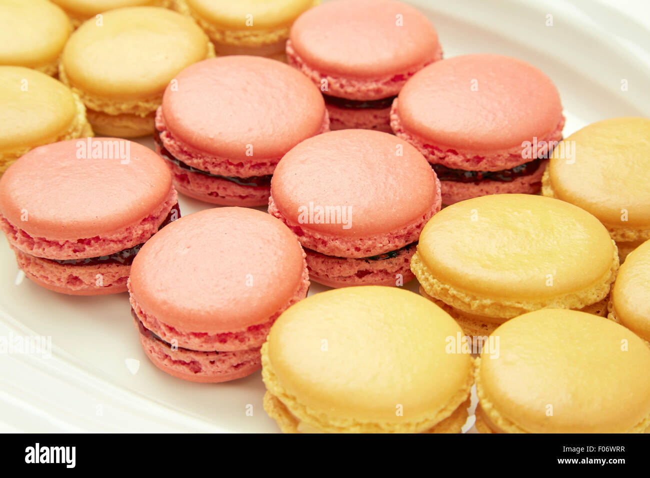 Close up Freshly Baked Tasty Yellow and Orange Macaroons Served on a ...