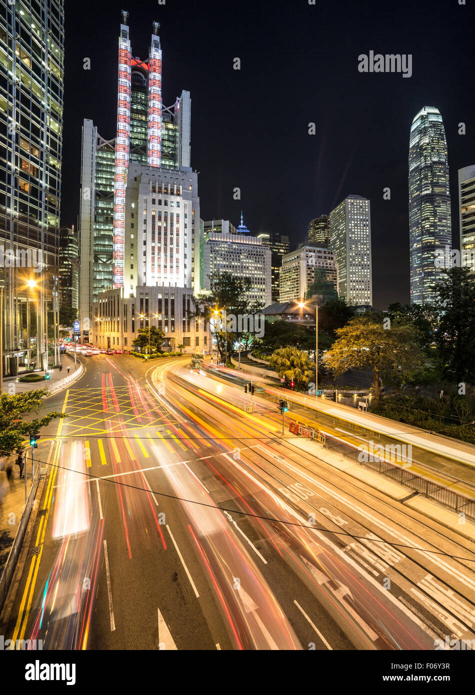 Cars rushing at night in Hong Kong business district around Admiralty ...