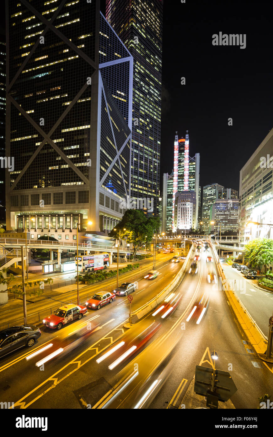 Cars rushing at night in Hong Kong business district around Admiralty ...