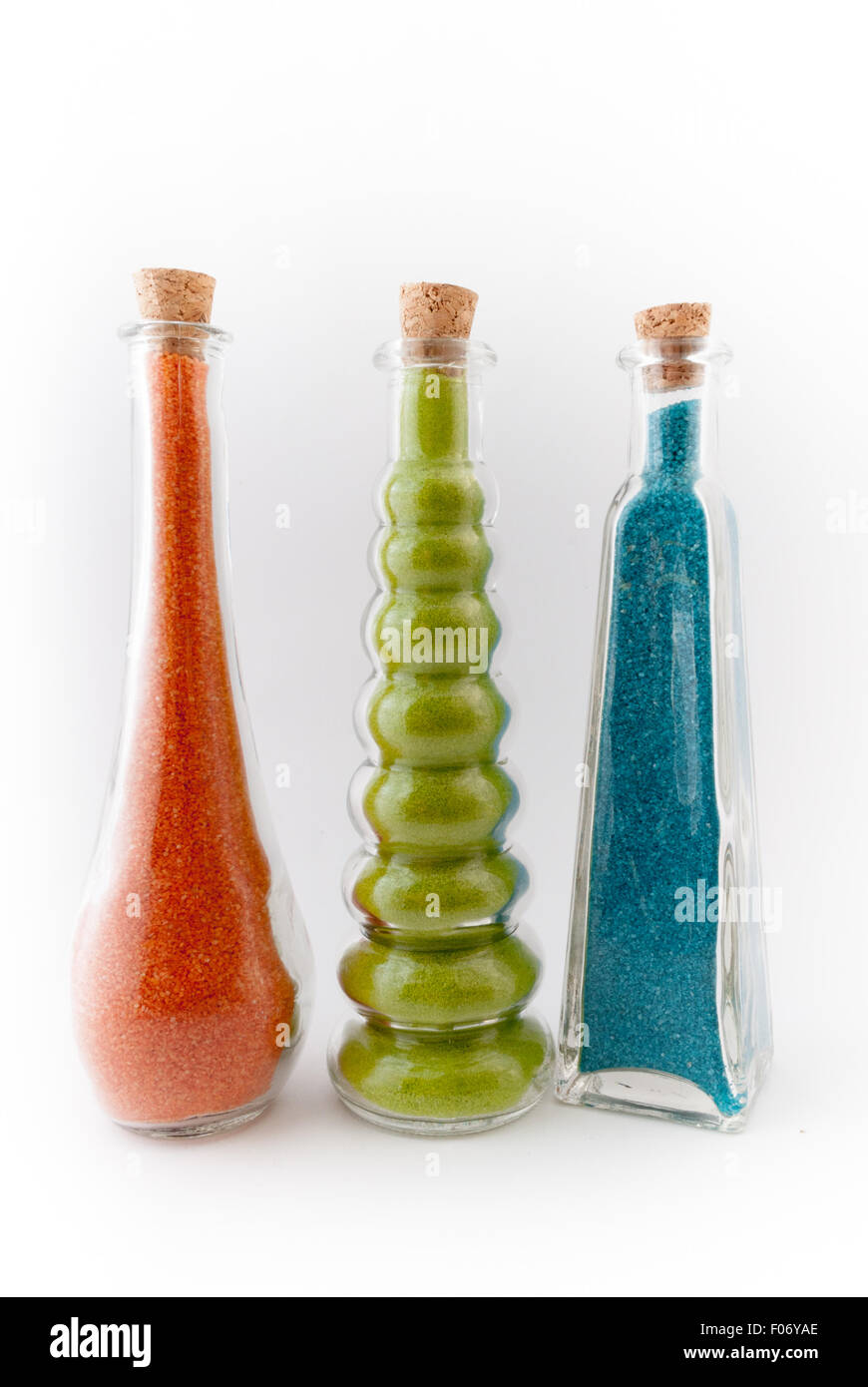 glass bottles with colorful sand isolated on a white background Stock ...