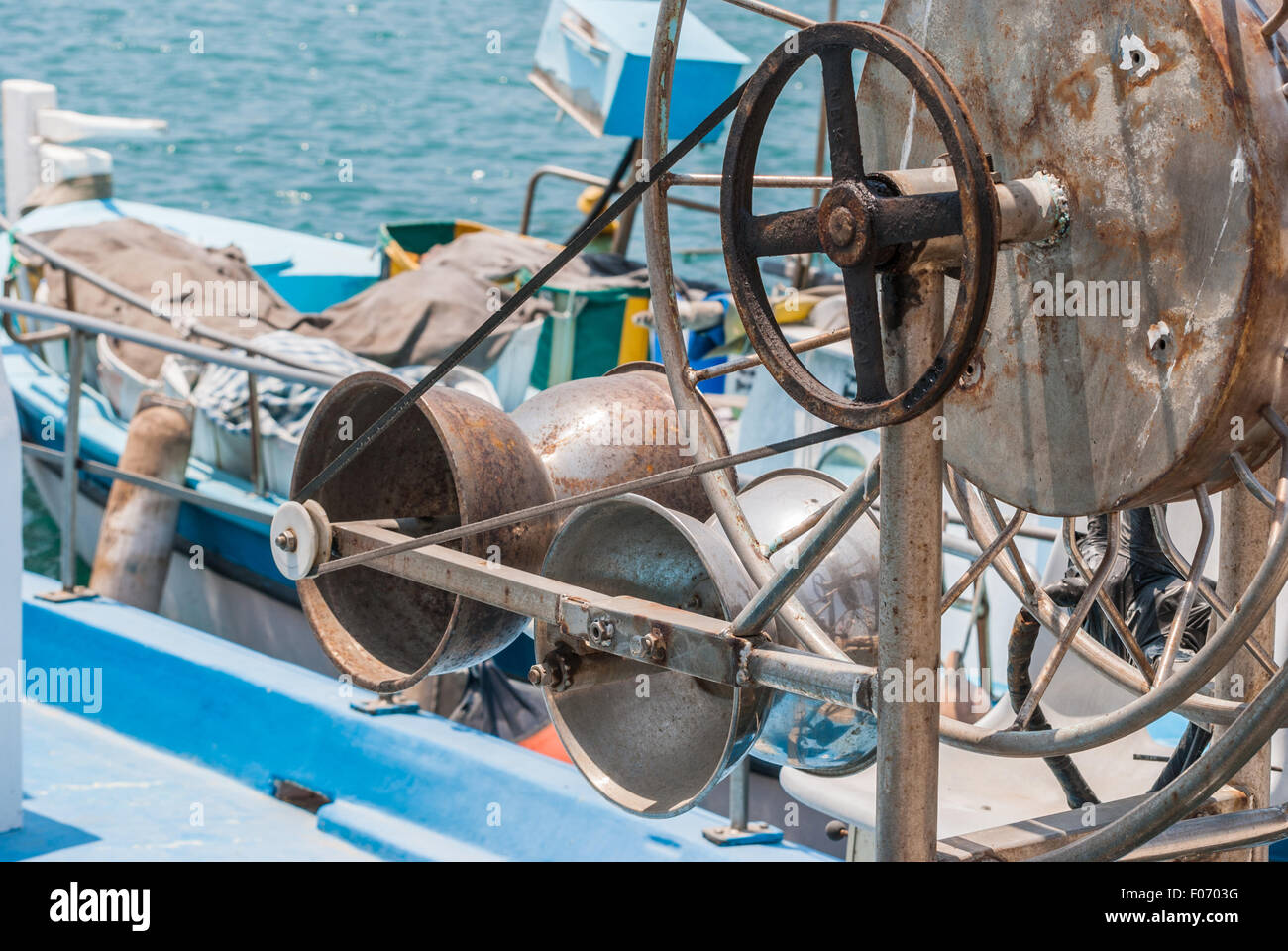 grey metal rusted hose reels on fishing boat Stock Photo - Alamy