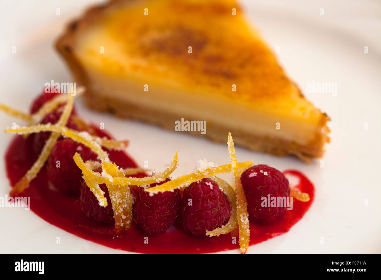 Lemon and raspberry tart Stock Photo - Alamy