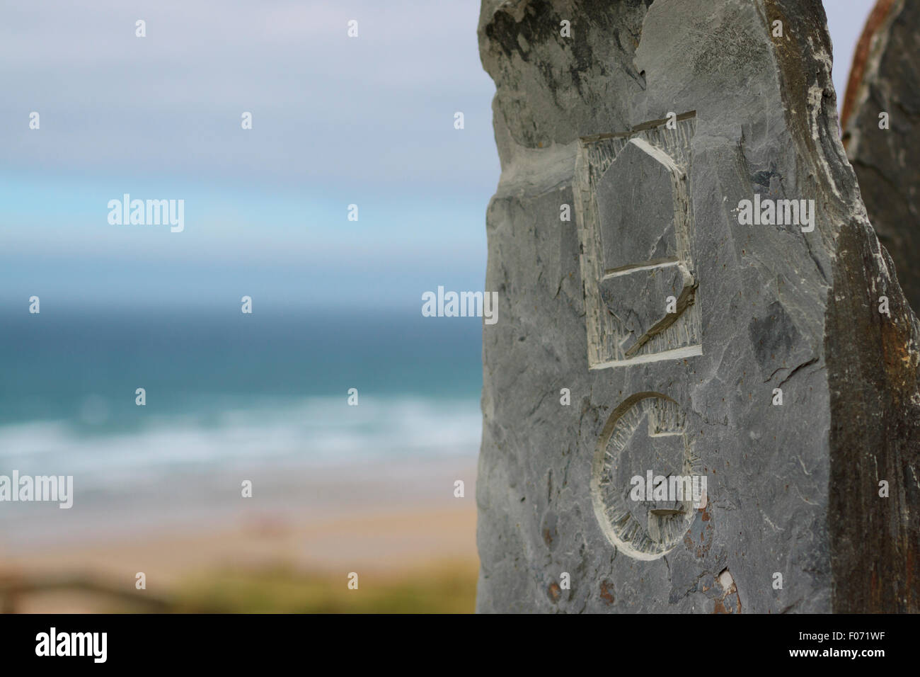 Slate way-marker for the South West Coast Path above Perran Beach, near ...