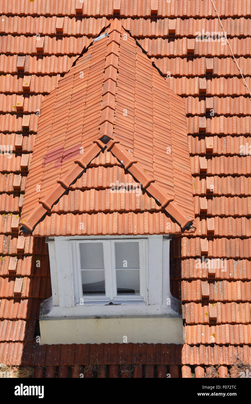 Framed window on the tile roof Stock Photo - Alamy