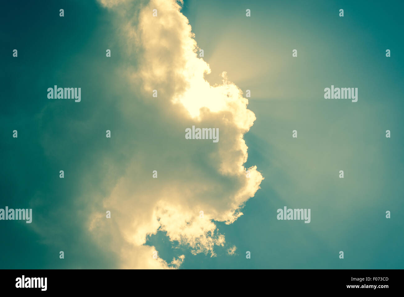 Big white cloud hiding the sun Stock Photo - Alamy