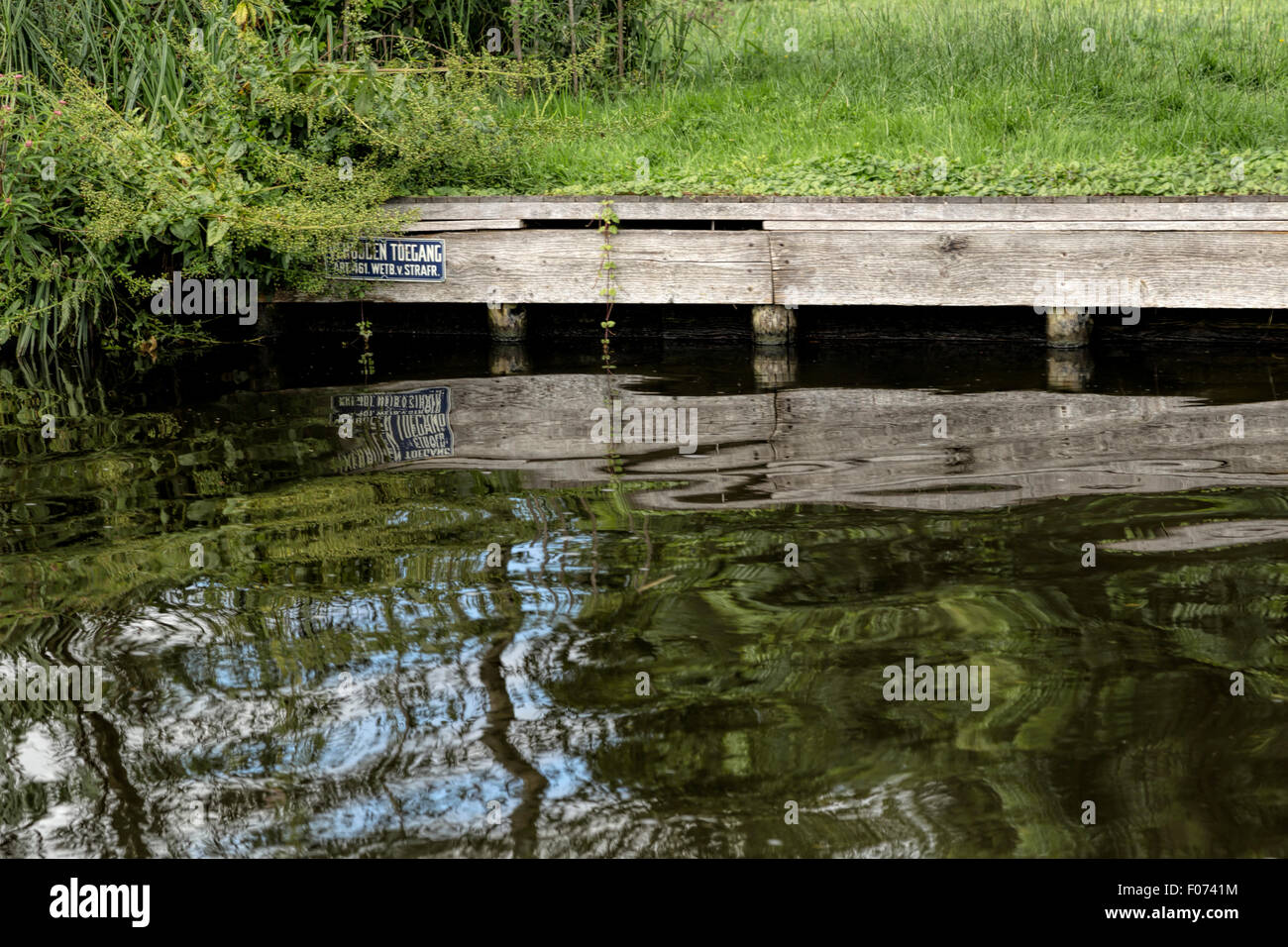 Forbidden entry sign, reflected in the water of Westeinderplassen, a ...