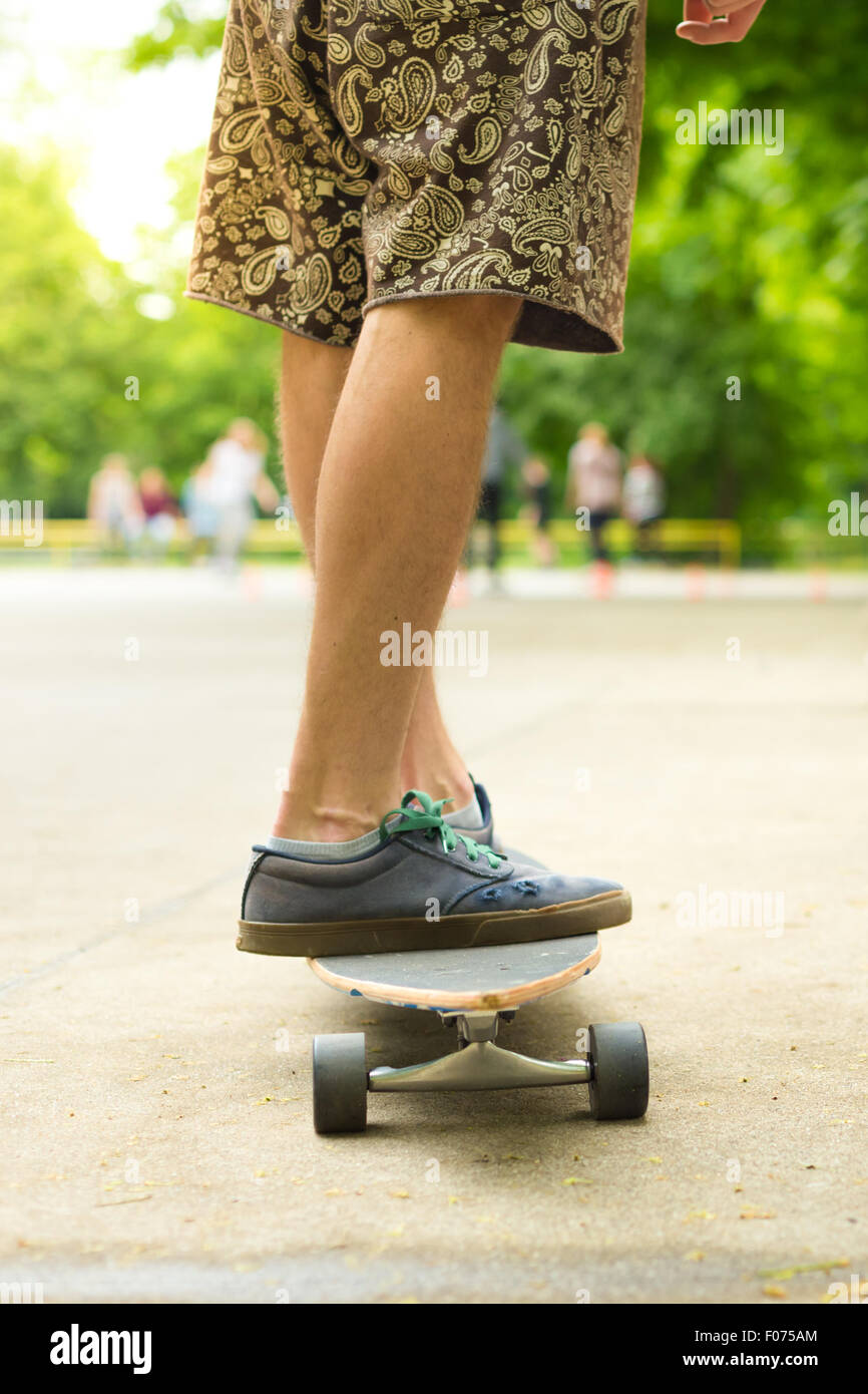 Guy riding long board Stock Photo - Alamy