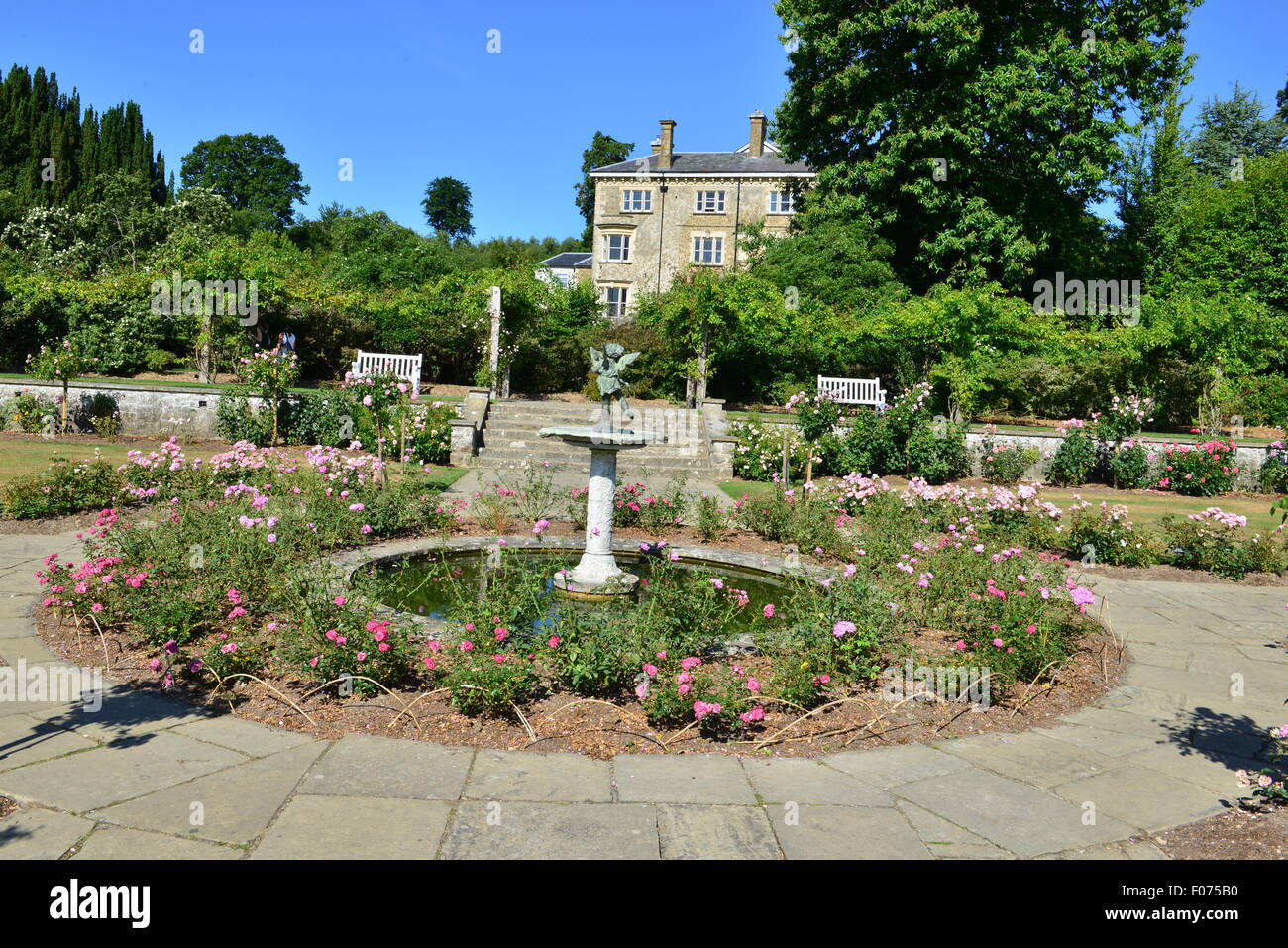 An Italian Rose garden in Kent with a pathway Stock Photo - Alamy