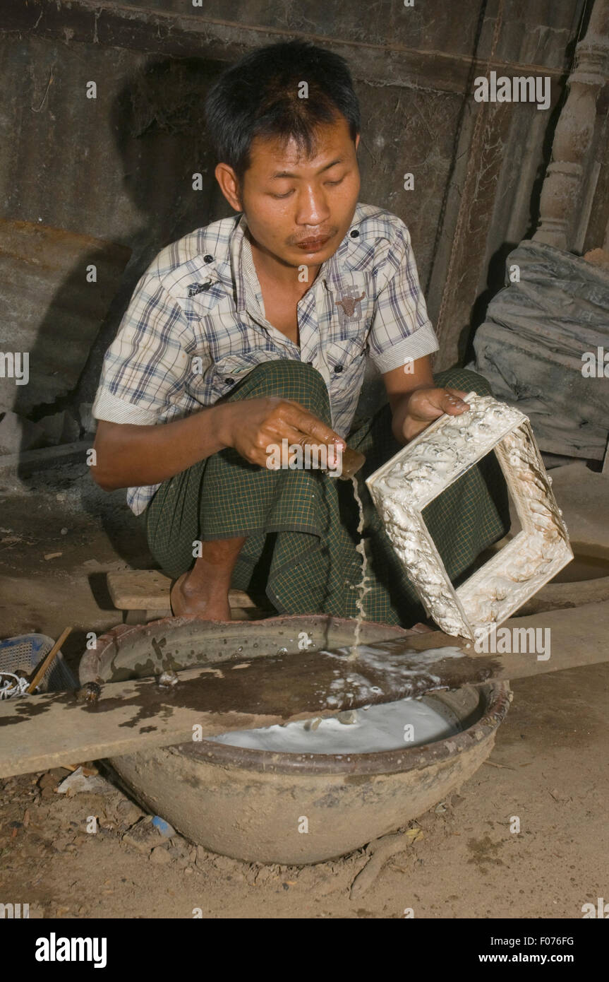 ASIA, MYANMAR (BURMA), Mandalay, man making silver bowl at metal works ...