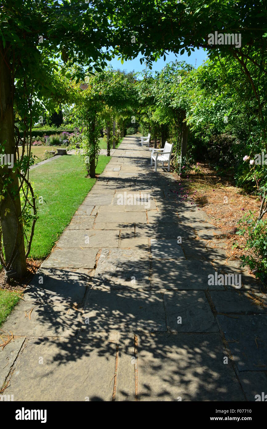 An Italian Rose garden in Kent with a pathway Stock Photo - Alamy
