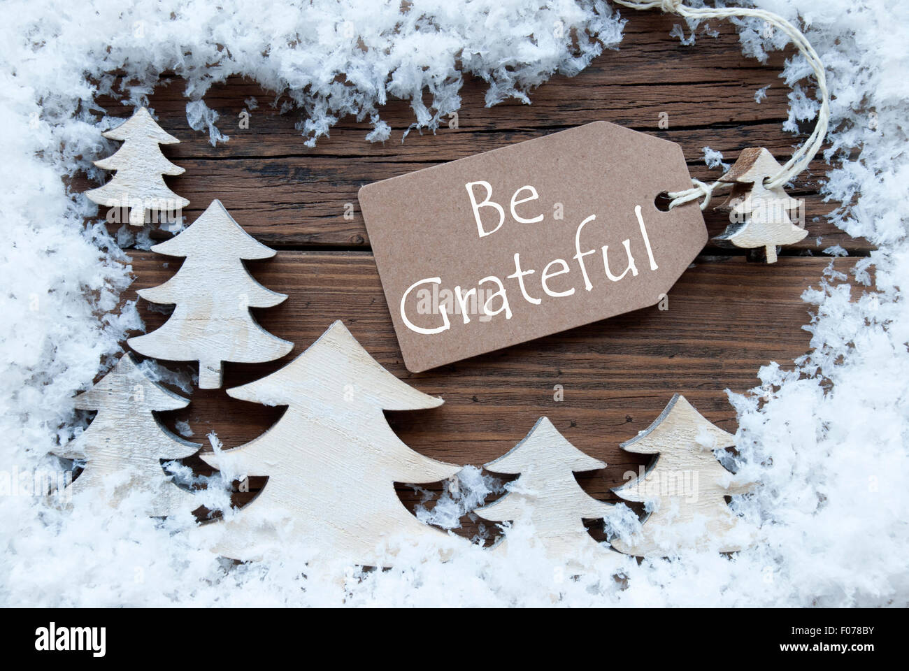 Label Christmas Trees And Snow Be Grateful Stock Photo - Alamy