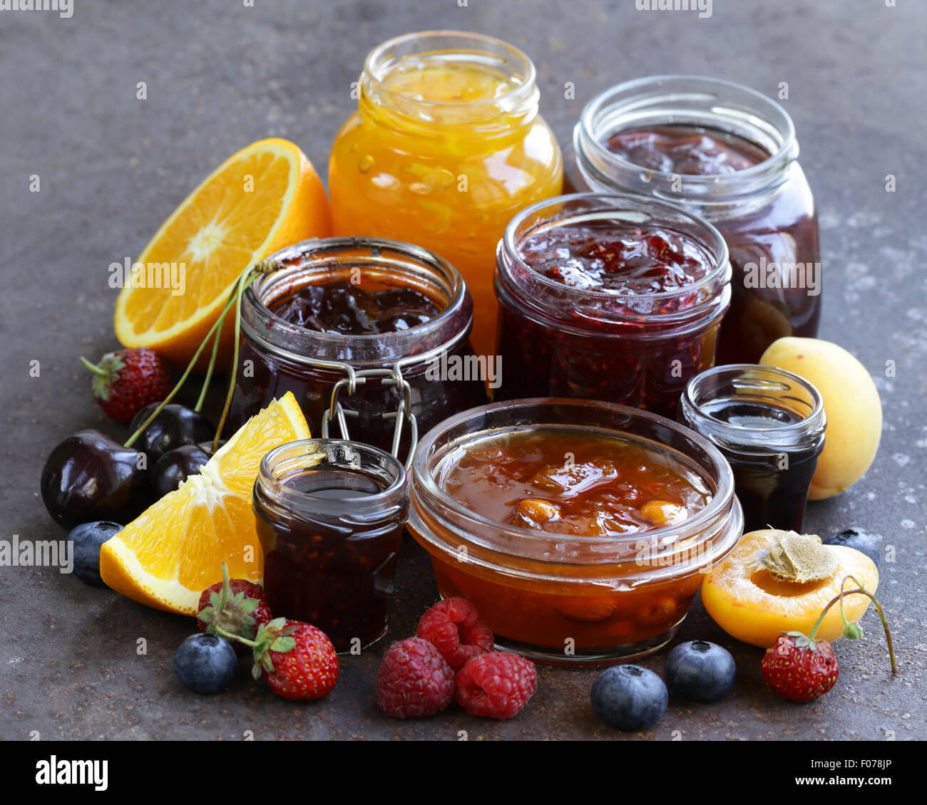 Assorted fruit berry jams (apricot, strawberry, raspberry, orange Stock ...