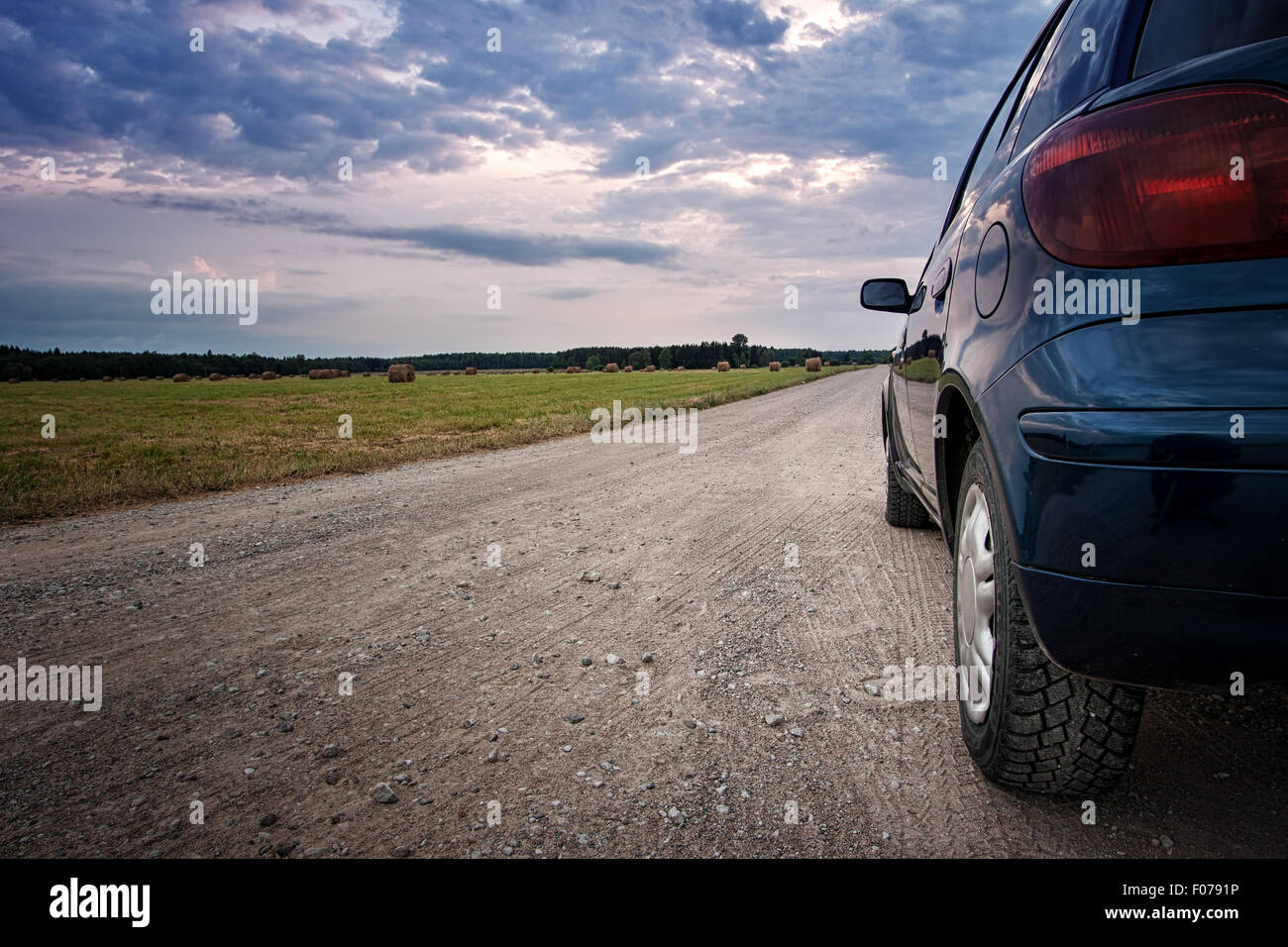 Car on country road Stock Photo - Alamy