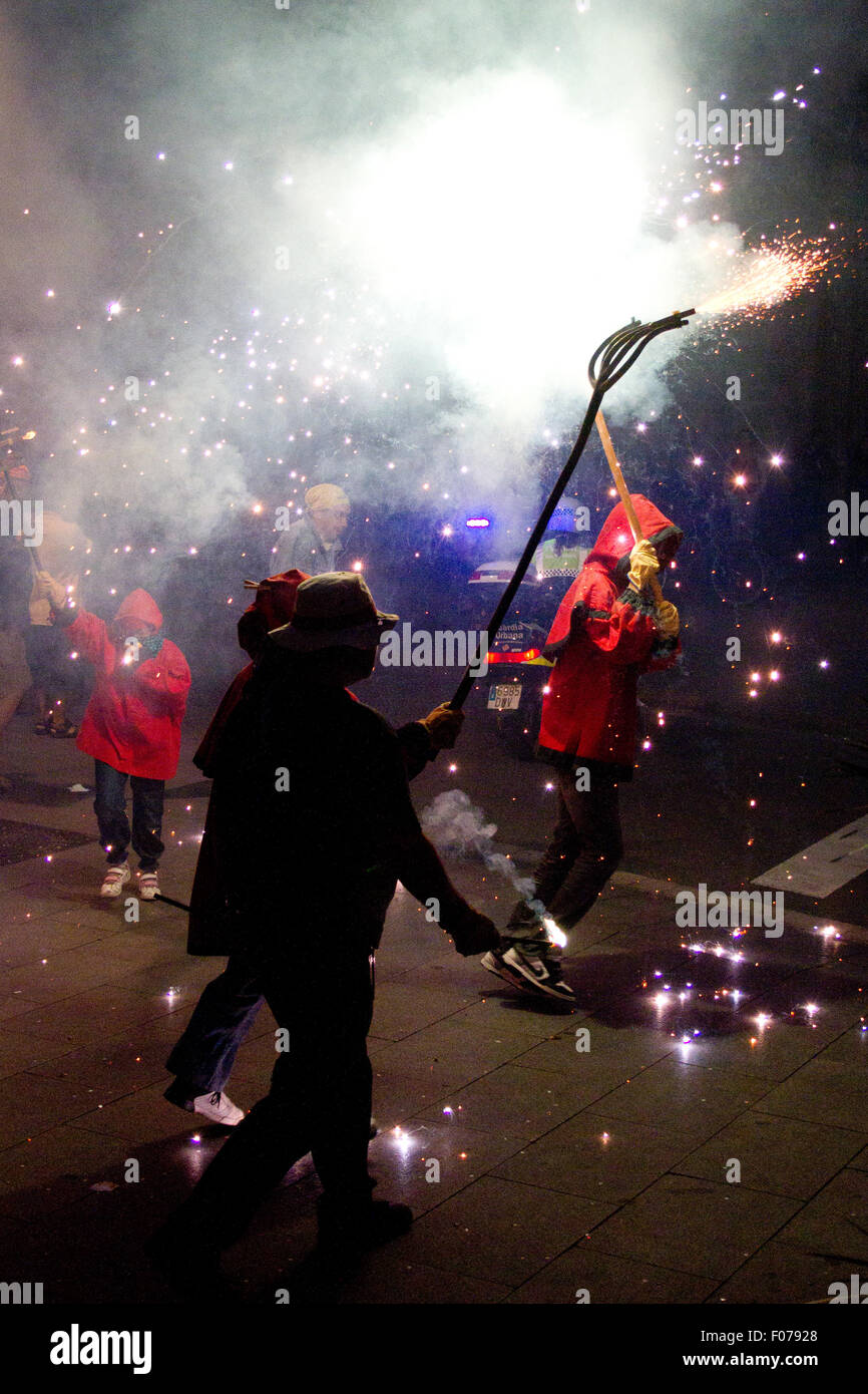 Fire-devils (correfoc) in traditional celebration in Raval neighborhood ...