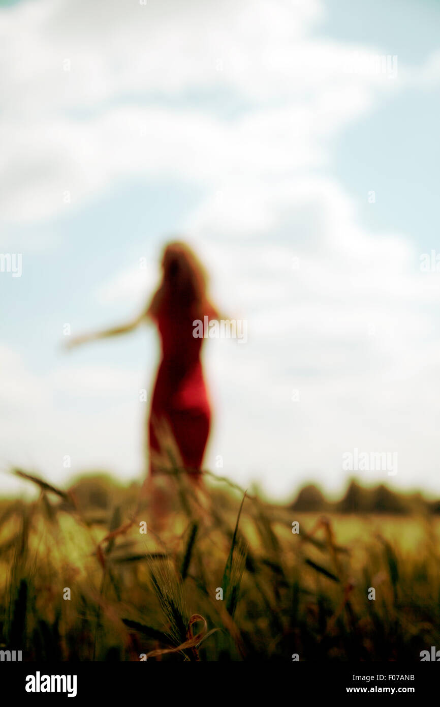 Blurred Female Figure in Park Stock Photo - Alamy
