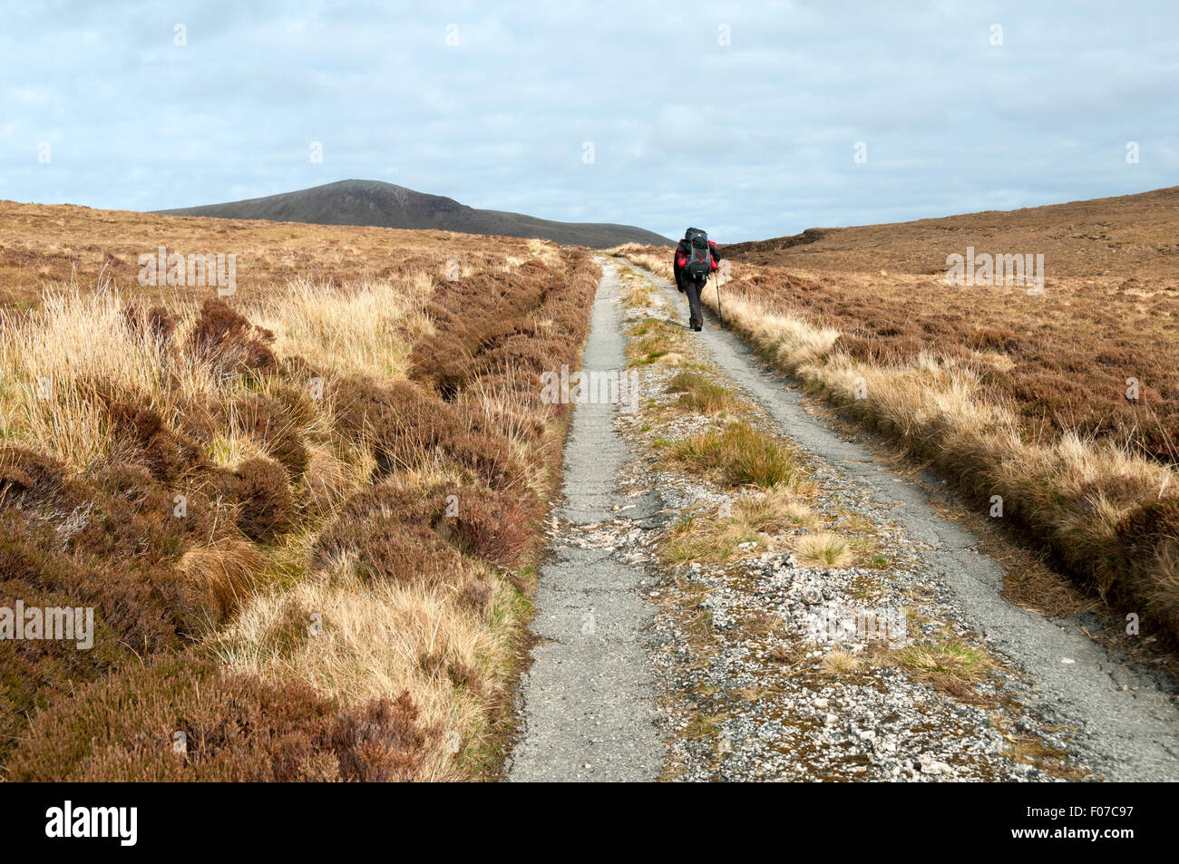 A walker in the Cape Wrath wilderness, Sutherland, Scotland, UK. On the ...