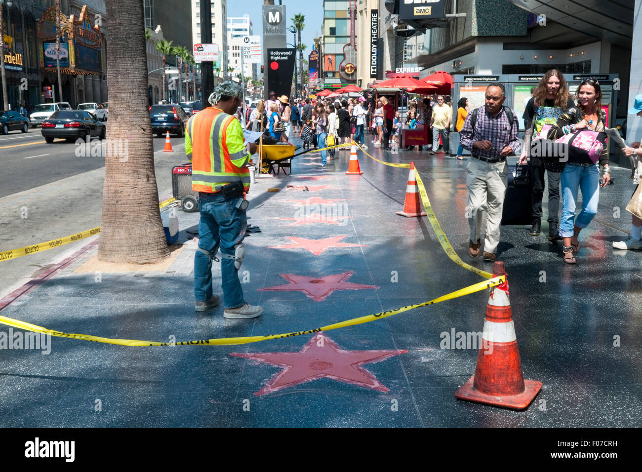 An engineer installing new star paving slabs in the pavement in ...
