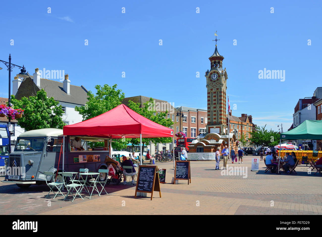Clock Tower and market stalls, High Street, Epsom, Surrey, England ...