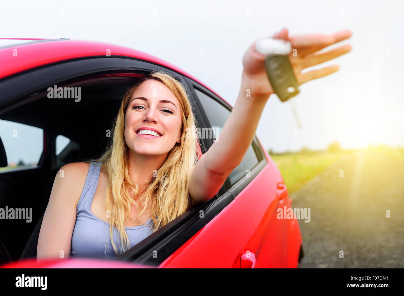 Woman showing keys Stock Photo - Alamy