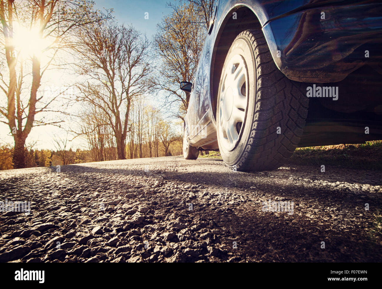 Car on asphalt road in spring morning Stock Photo - Alamy