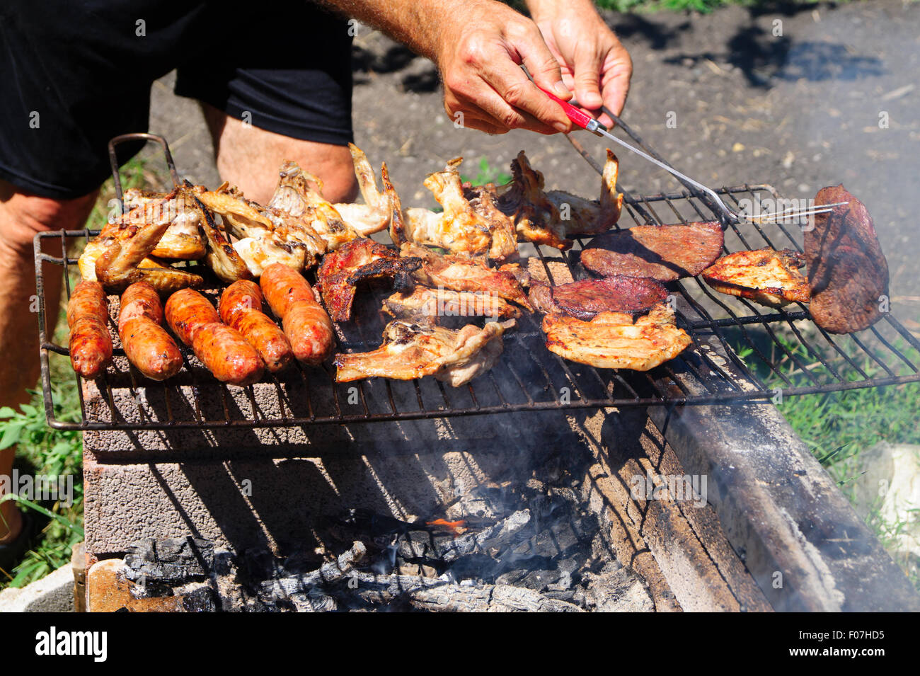 Man smoke meat hi-res stock photography and images - Alamy