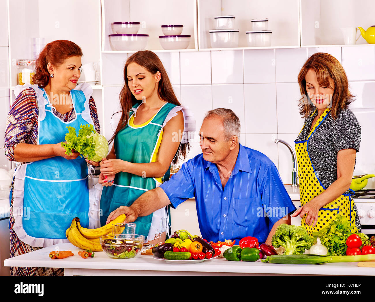 Family cooking at kitchen Stock Photo - Alamy