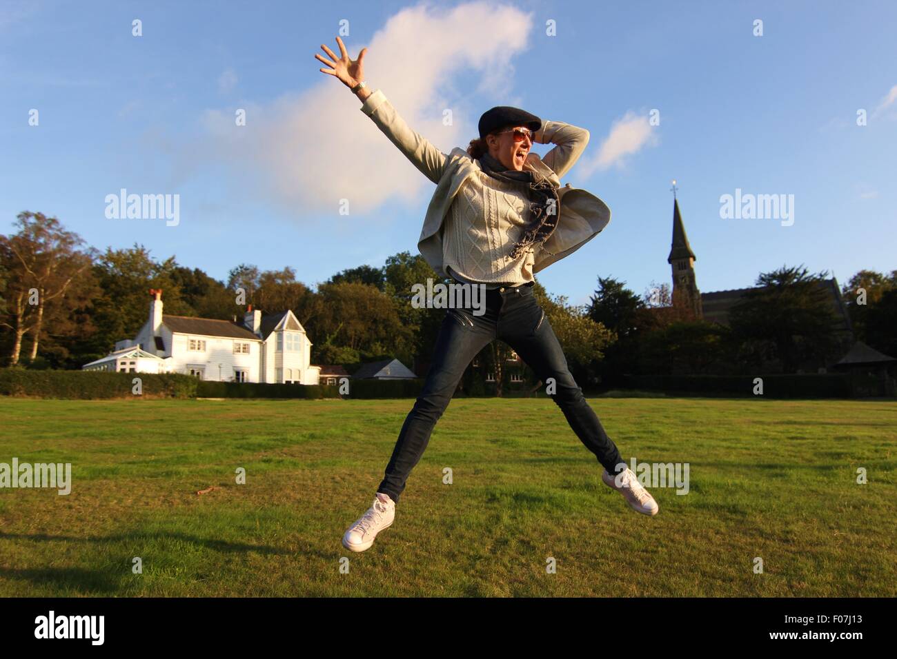 Happy Woman Jumping Stock Photo - Alamy