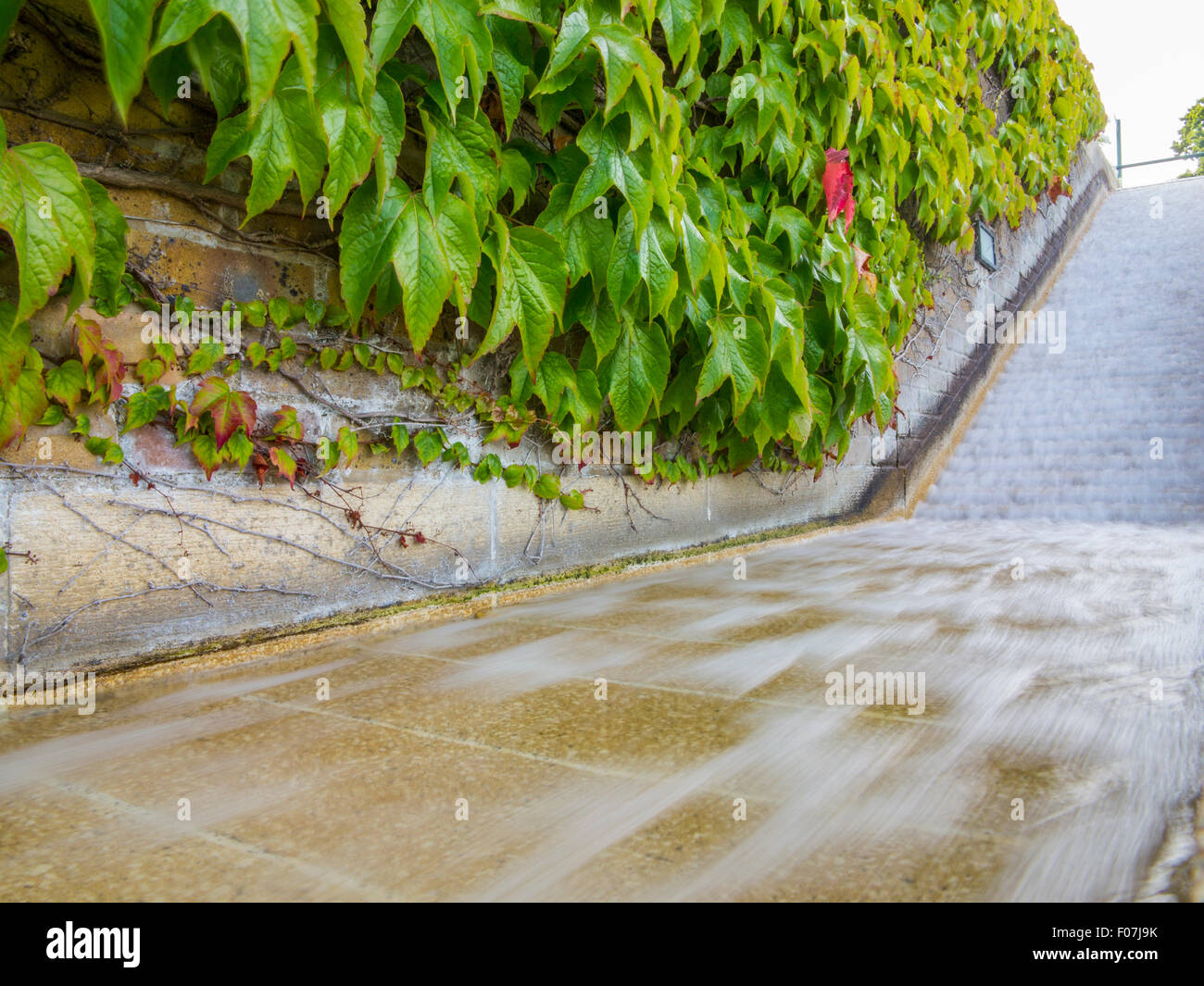 A fountain and waterfall water feature at the All England Tennis Club ...