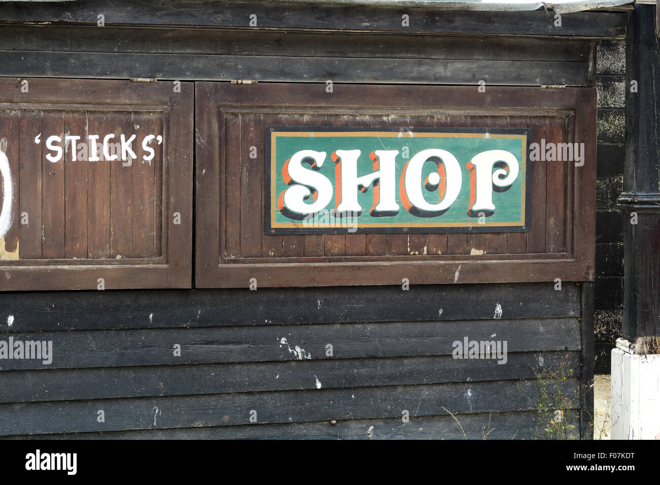 The word Shop on the side of a shed Stock Photo - Alamy