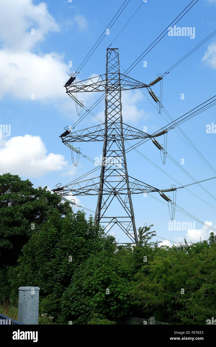Electricity pylon showing the cables and connectors set against a blue ...