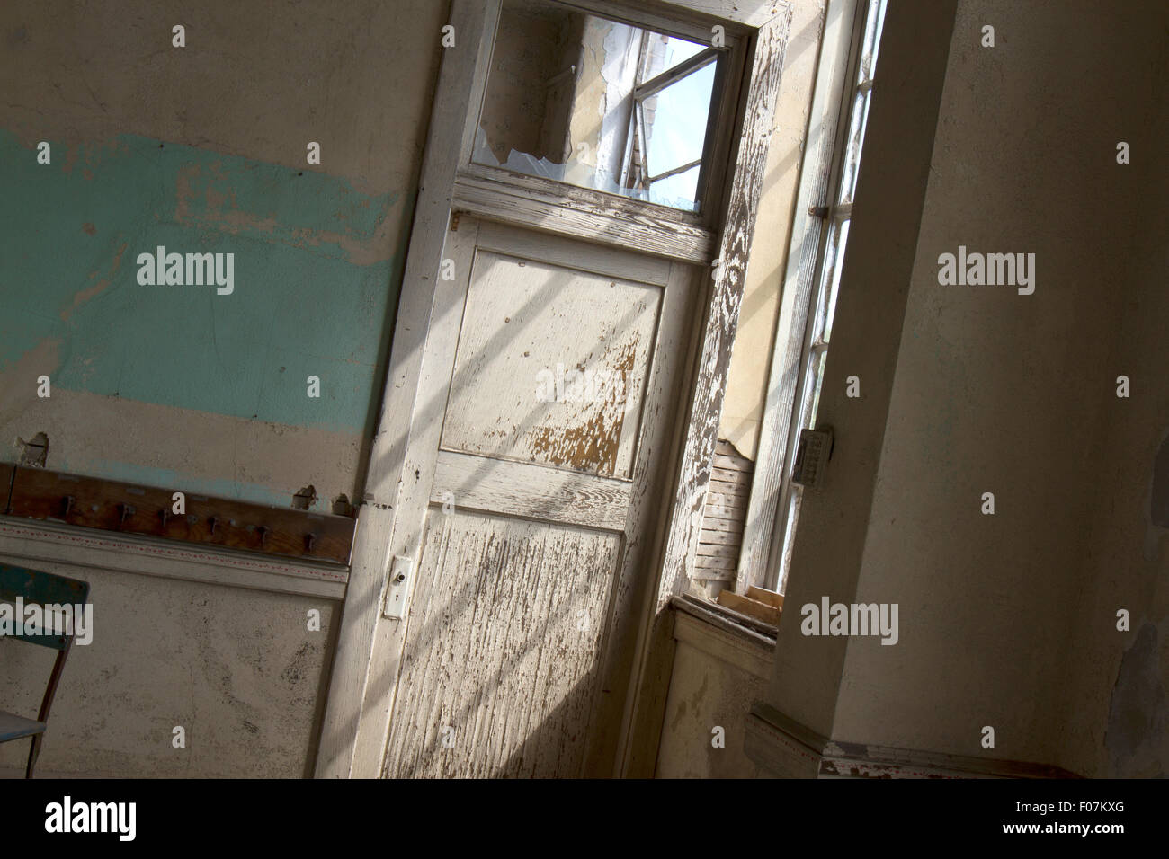 Light coming through broken window in old school room Stock Photo - Alamy