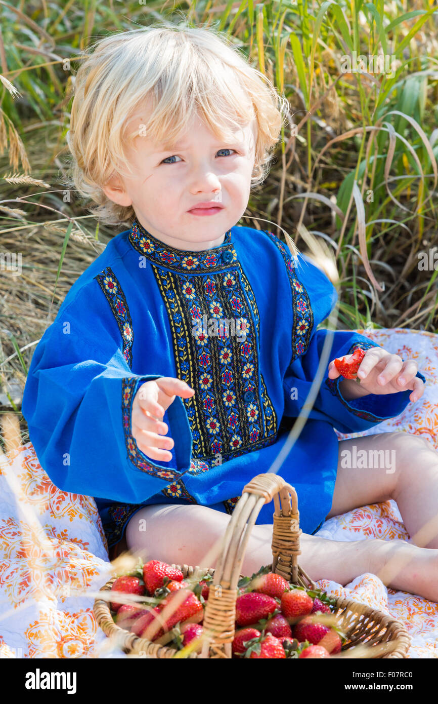 Russian children in traditional Russian costumes playing in the forest ...