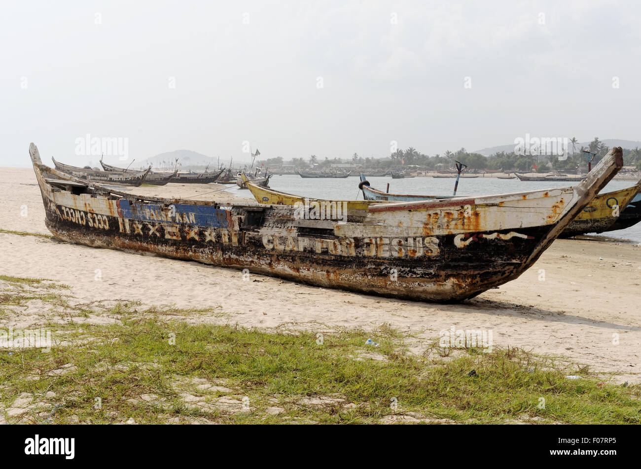 ACCARA, GHANA - FEBRUARY 22, 2014: Fishing poor boats on sea sand coast ...