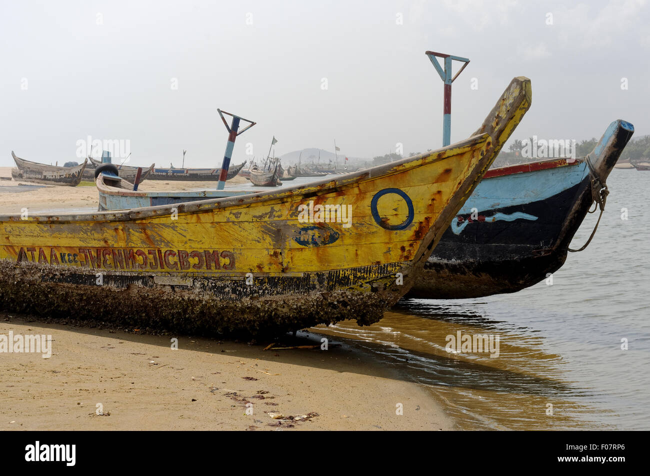 ACCARA, GHANA - FEBRUARY 22, 2014: Fishing poor boats on sea sand coast ...