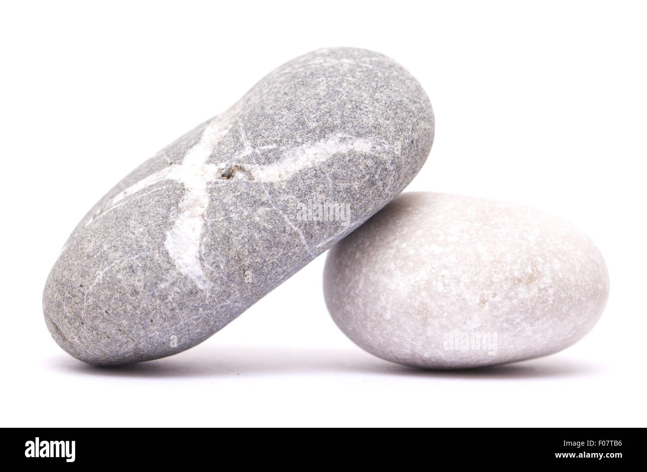 two pebbles isolated on white background Stock Photo - Alamy