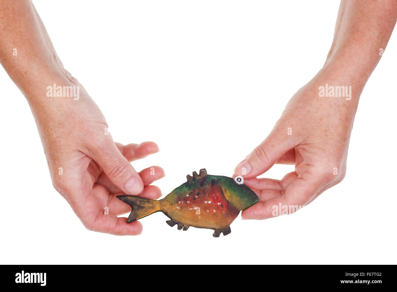 Hand holding small fish woman hi-res stock photography and images - Alamy