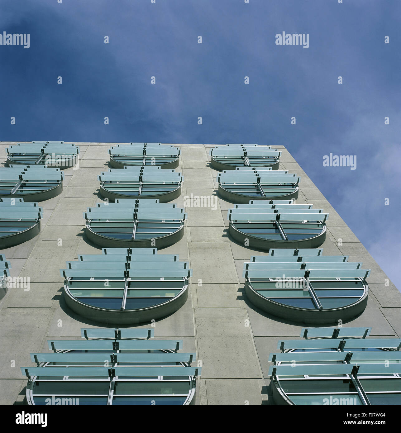 Modern circular windows on concrete structure Stock Photo - Alamy