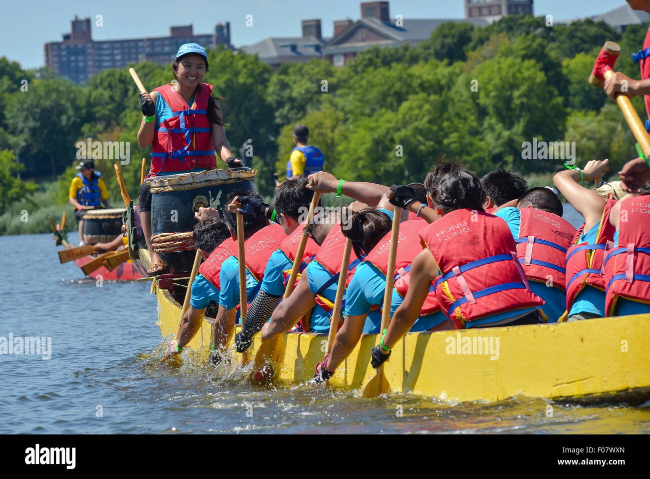 Queens, United States. 09th Aug, 2015. A dragon boat drummer pounds her ...