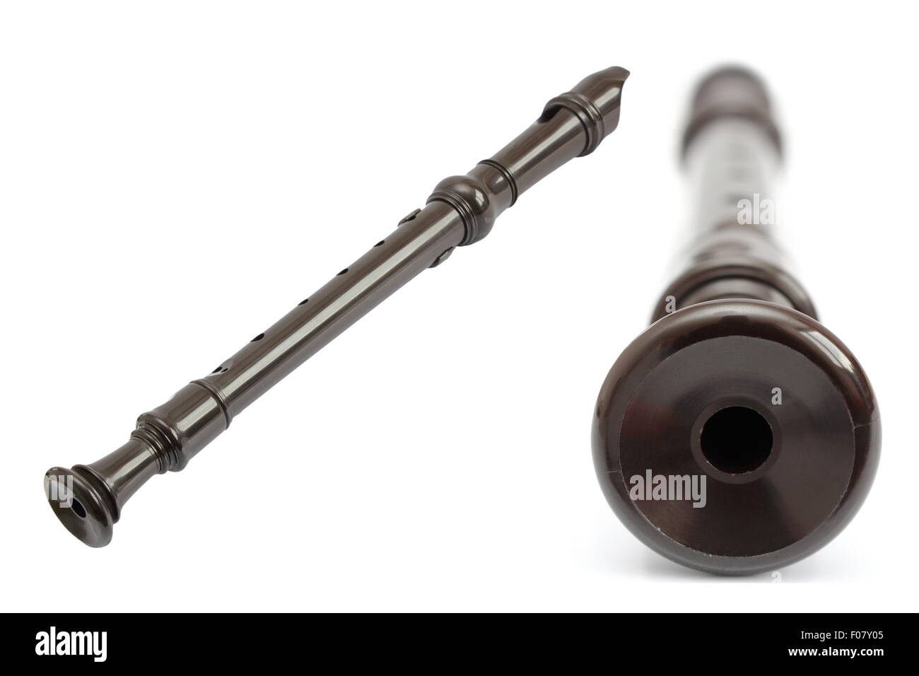 dark plastic blockflute isolated over white background Stock Photo - Alamy