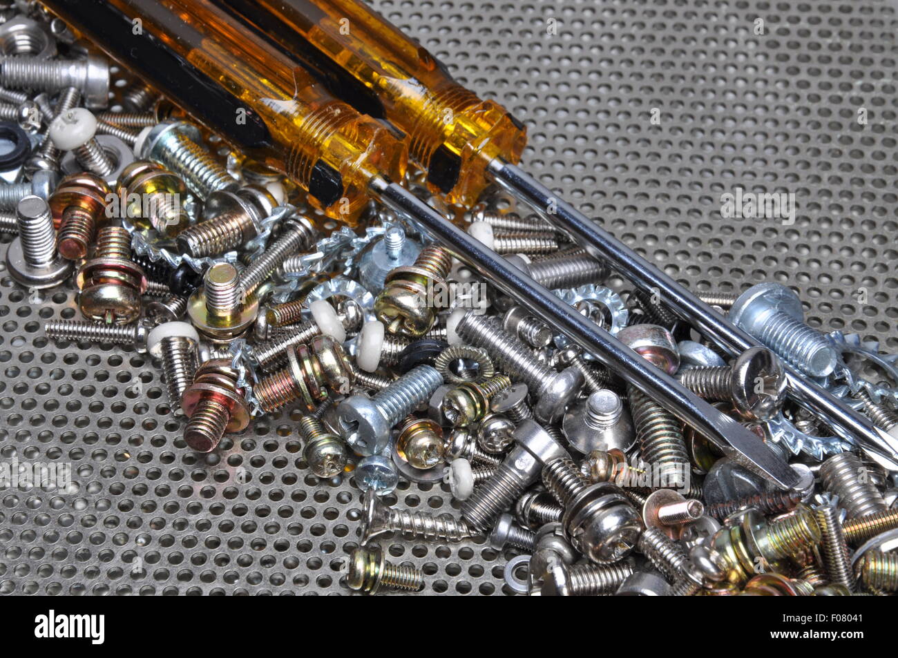 Screwdrivers and components bolts, nuts, washers, screws Stock Photo ...