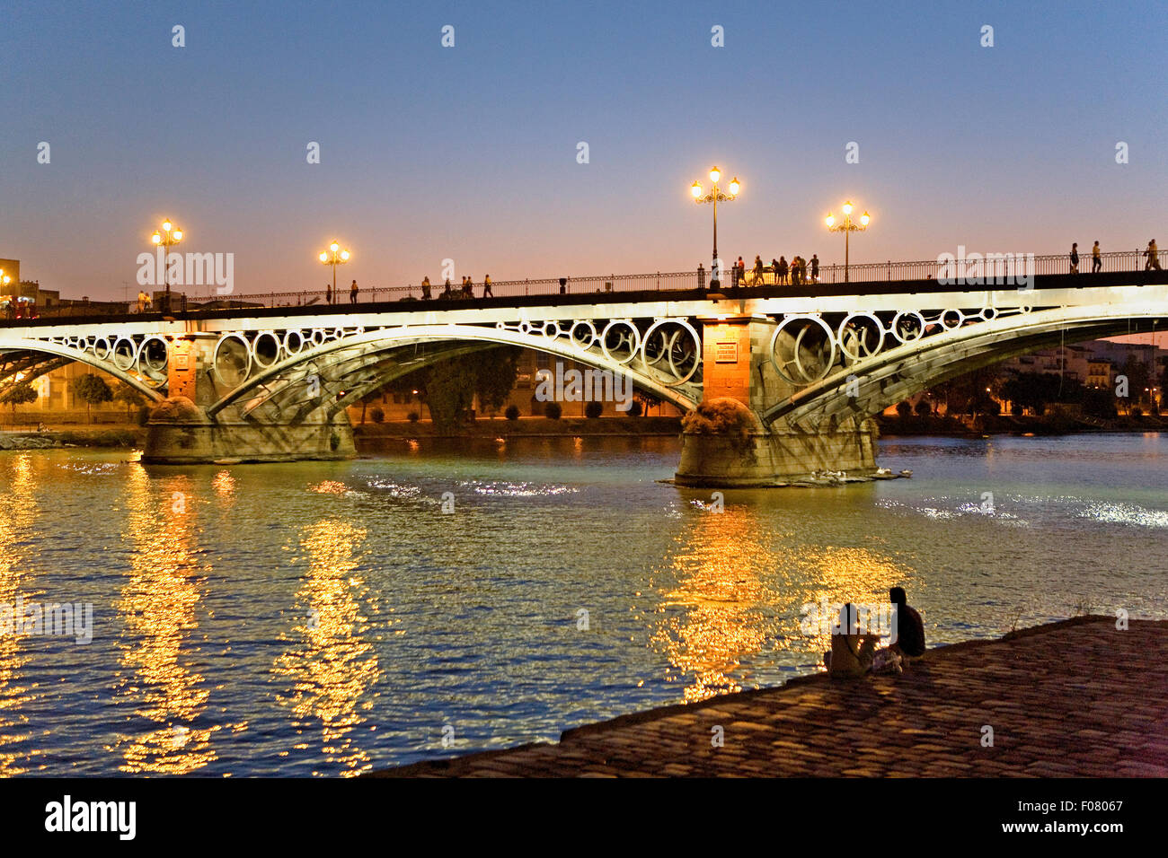 Isabel II bridge or Triana bridge. Guadalquivir river. Seville ... Isabel II bridge or Triana bridge. Guadalquivir river. Seville ...