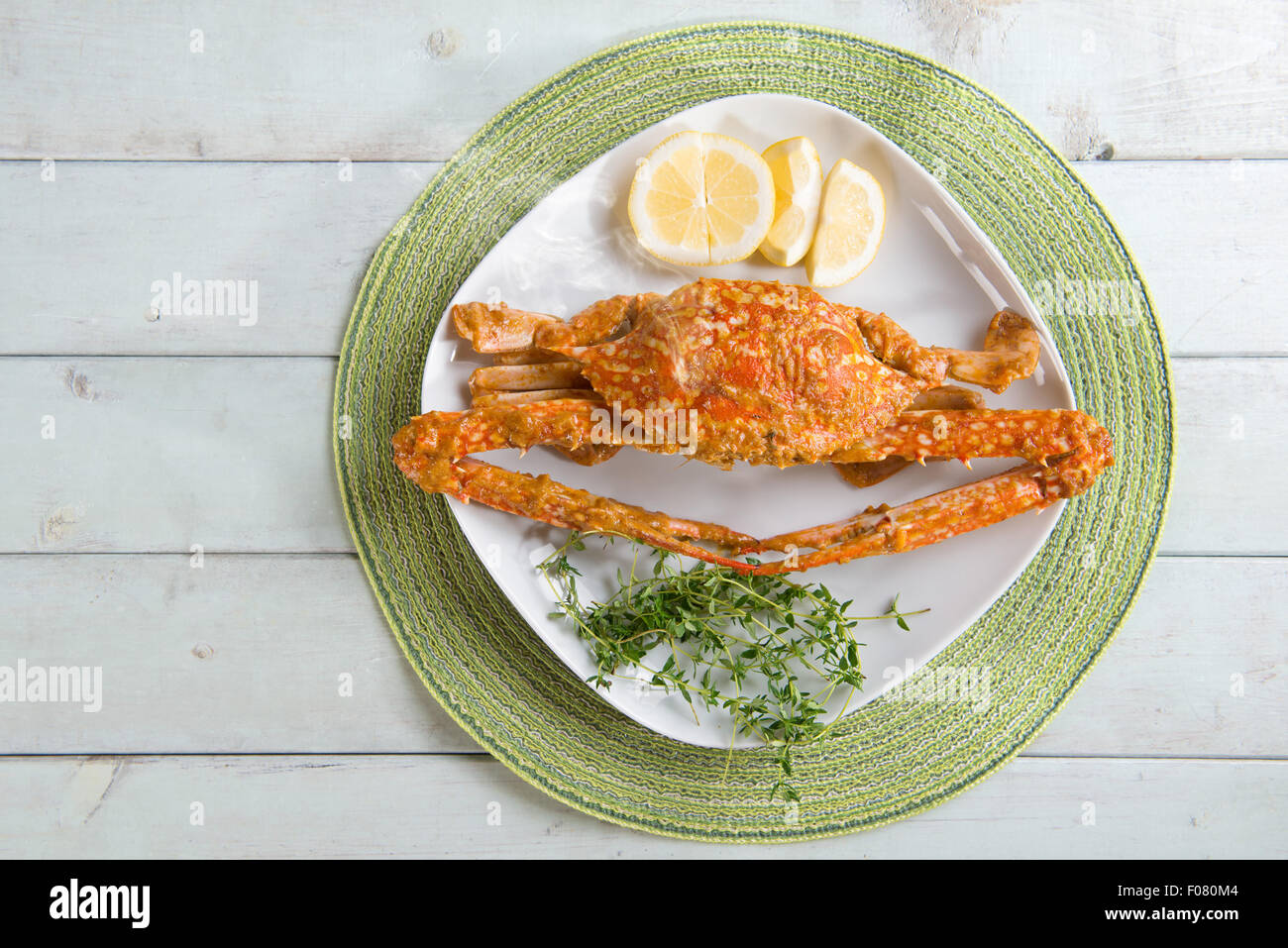 Overhead view cooked delicious hot and spicy sauce blue crab on white ...