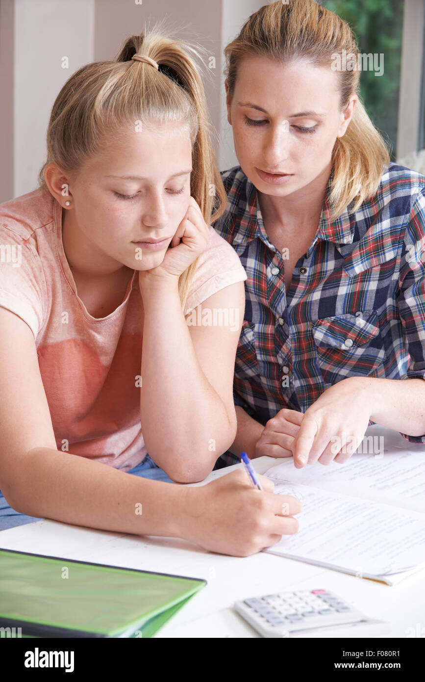 Female Home Tutor Helping Girl With Studies Stock Photo - Alamy