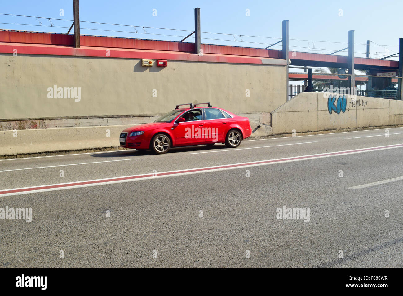 Red car on road Stock Photo - Alamy